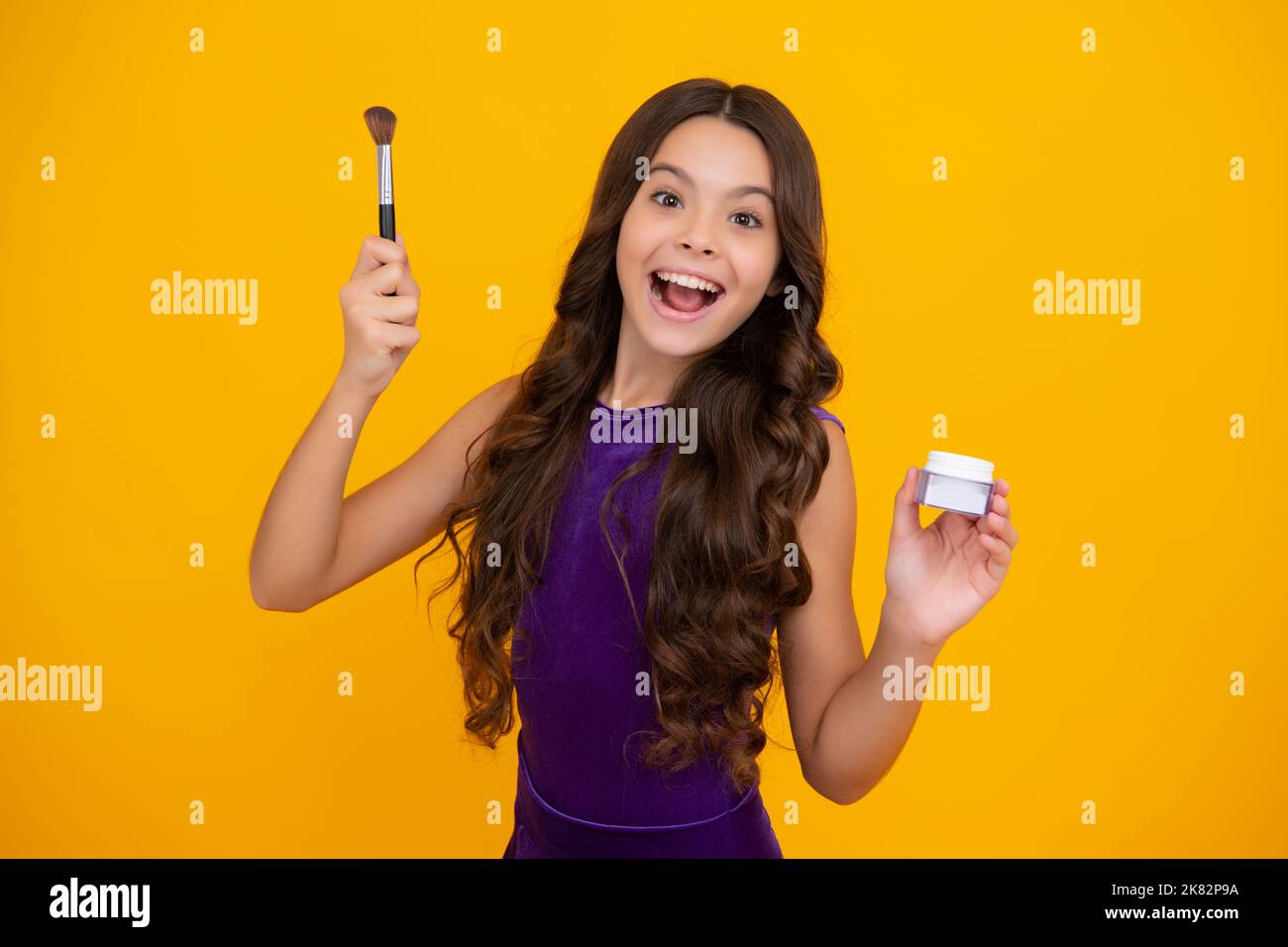 Beautiful portrait of teen girl child artist apply powder with make up ...