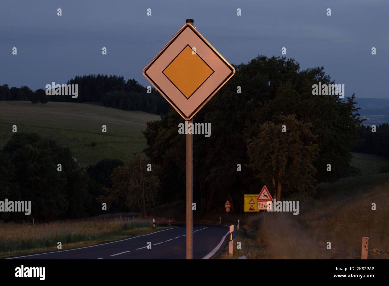 Priority sign – traffic sign right of way Stock Photo - Alamy