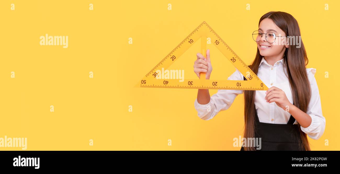 mathematics. happy teen girl hold triangle. back to school. algebra and ...