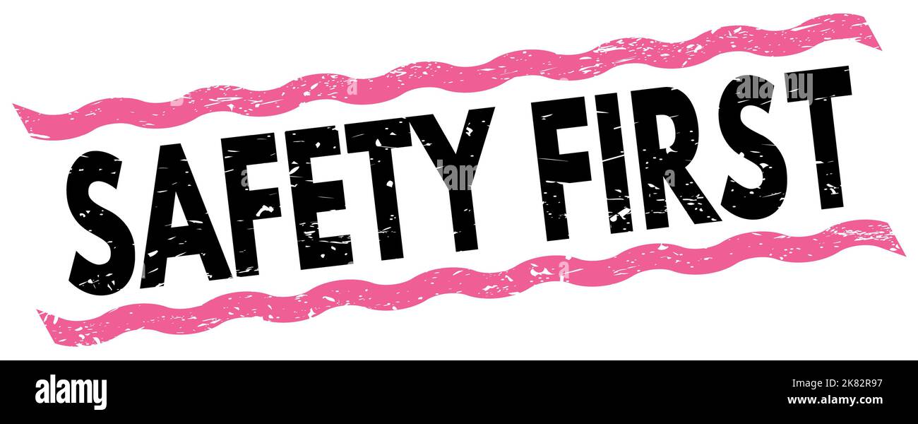 SAFETY FIRST text written on pink-black lines stamp sign Stock Photo ...