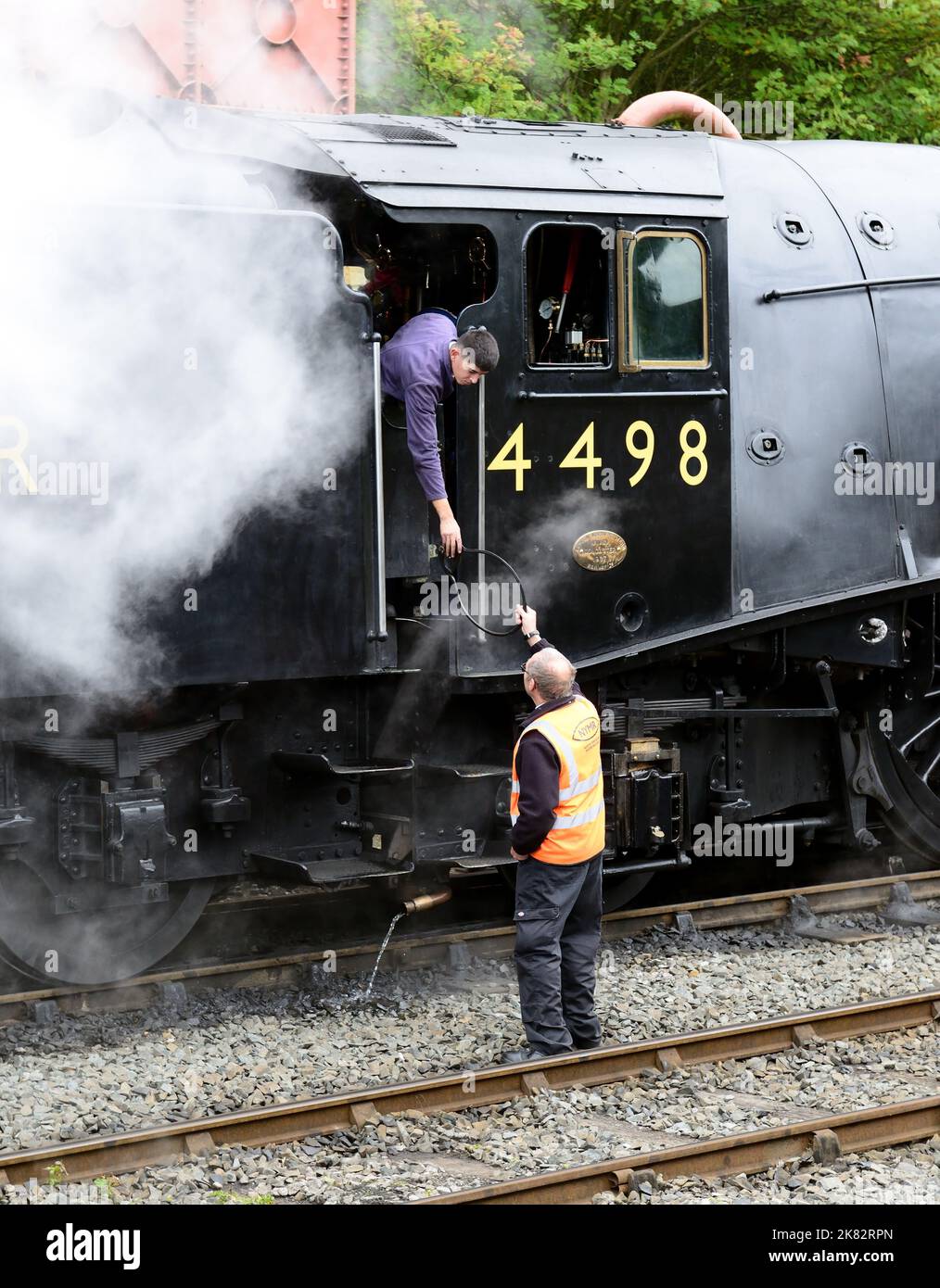 The crew of Sir Nigel Gresley handing over the single line token to the ...