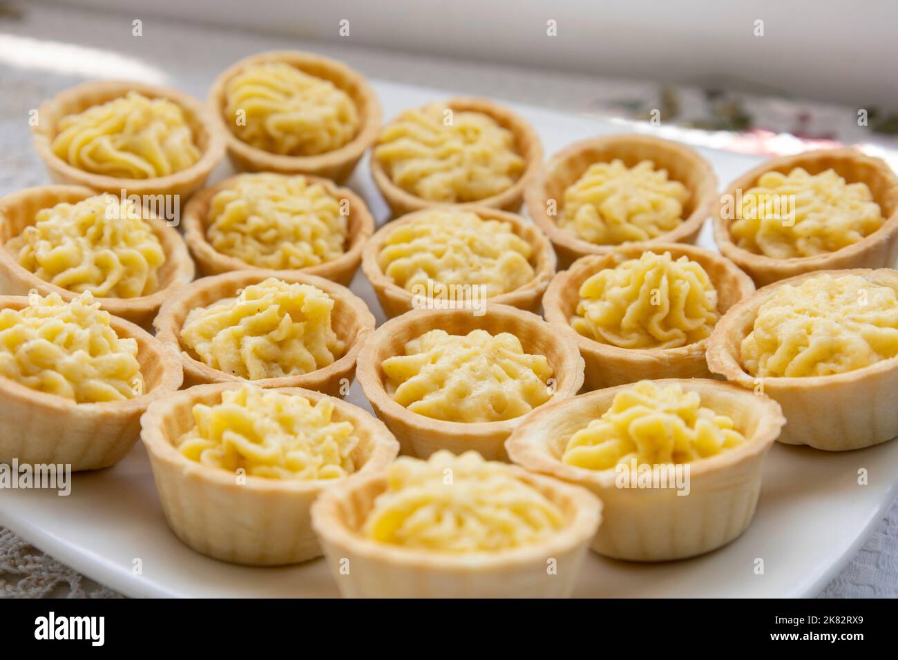 preparation of cupcakes with pastry cream, delicious sweet dessert ...
