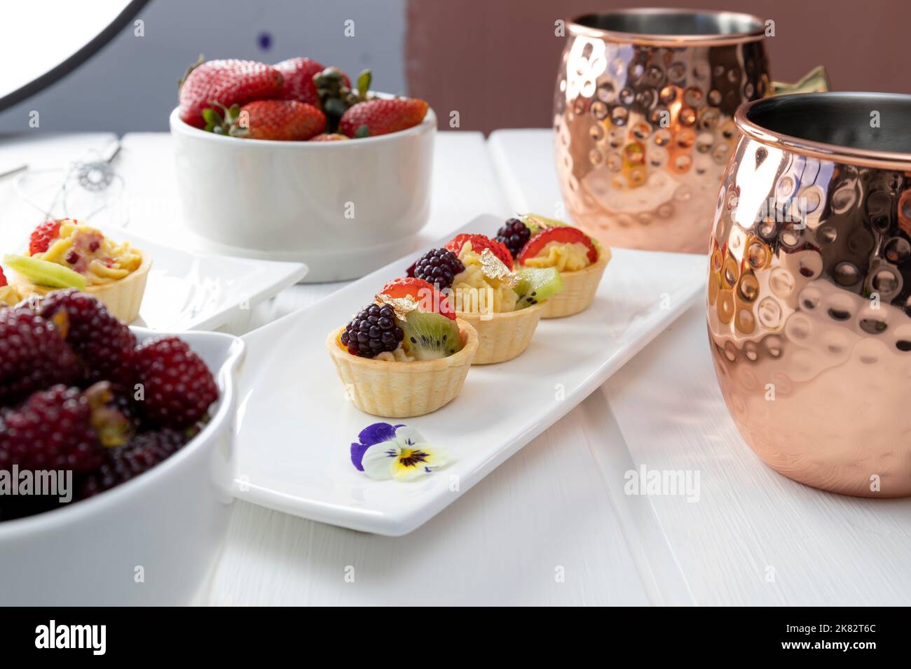 food, appetizing cake decorated with fruits and glass with drink ...