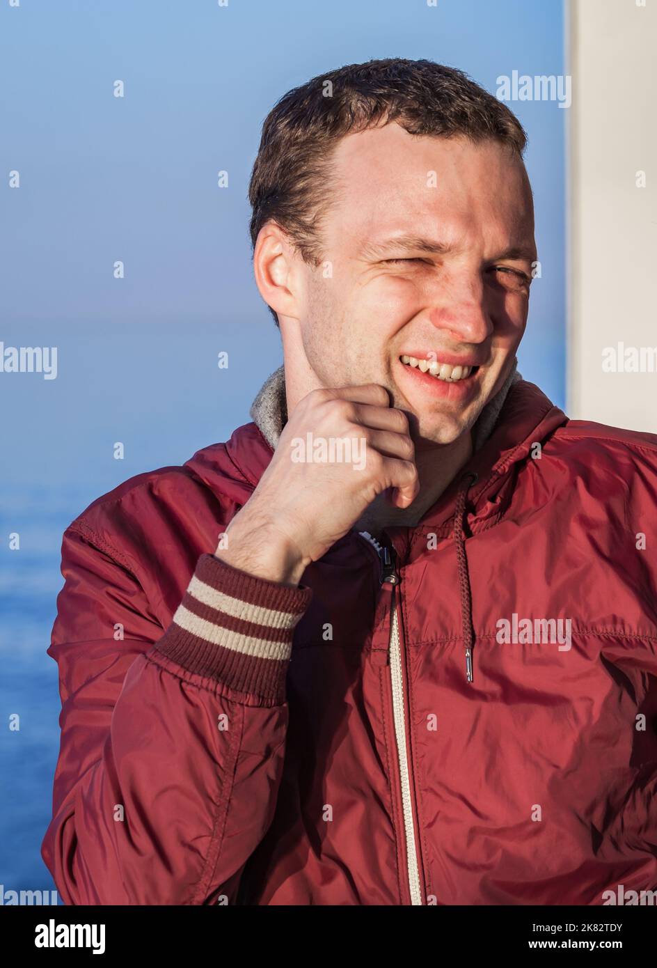 Smiling young adult European man, close up outdoor portrait Stock Photo ...