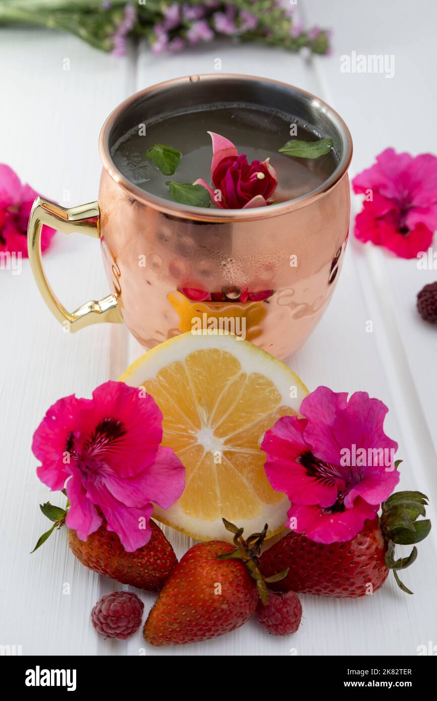 decoration with natural flowers in studio, refreshing drink with ice ...