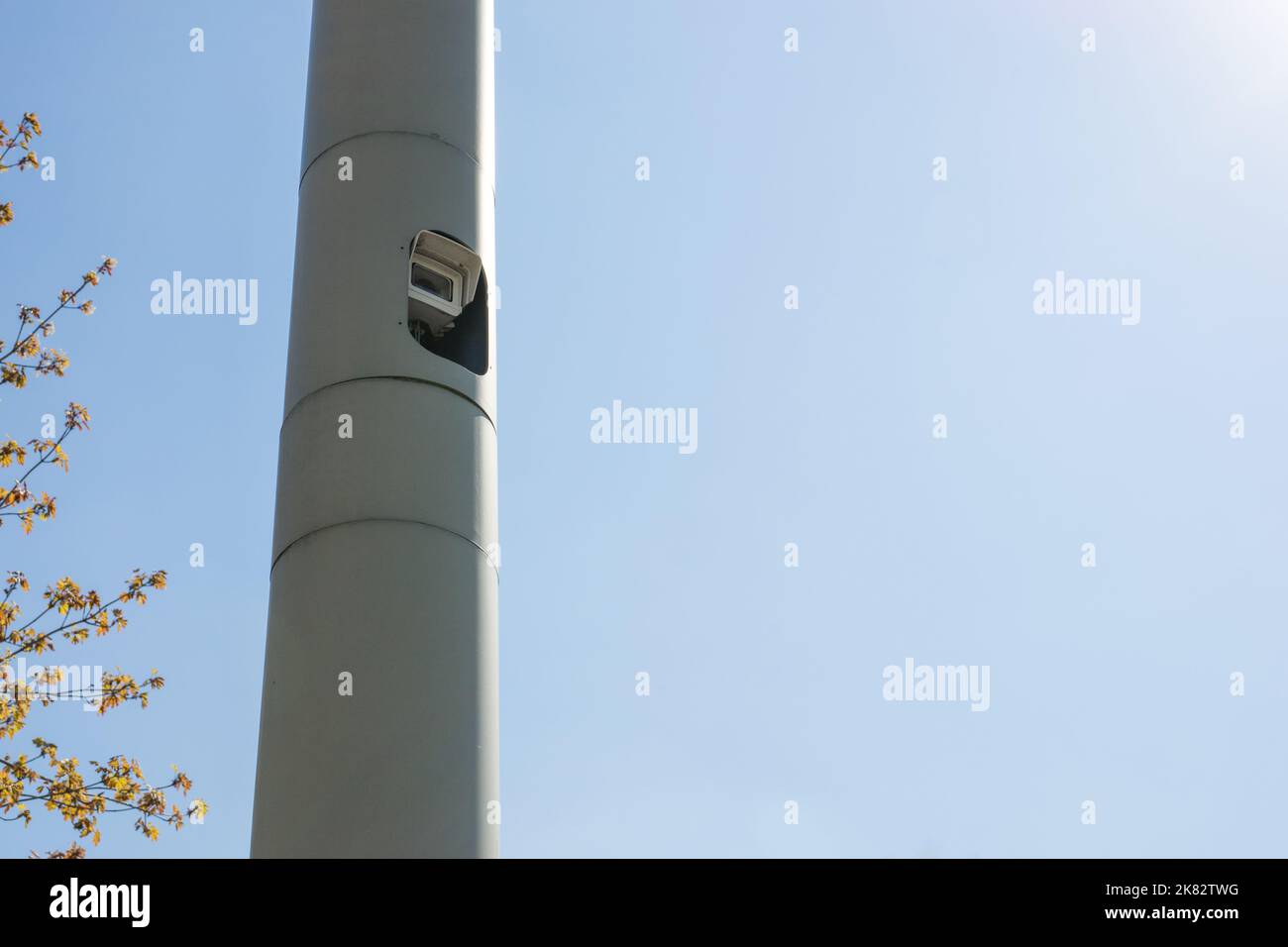 Hidden security camera in a pole with a blue sky background. Privacy ...