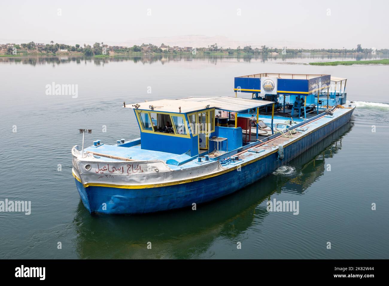 A Nile cruise boat mobile refuelling barge Stock Photo - Alamy