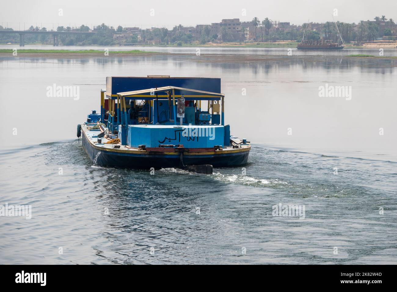 A Nile cruise boat mobile refuelling barge Stock Photo - Alamy