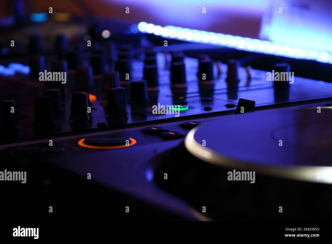 Closeup of professional DJ set consisting of DJ mixer and DJ deck with ...