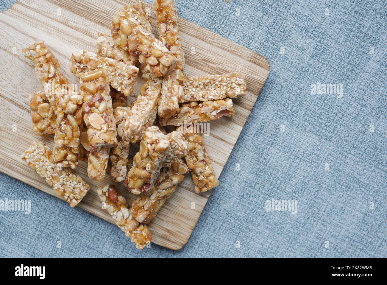 peanuts sweet candy on a plate top view Stock Photo - Alamy