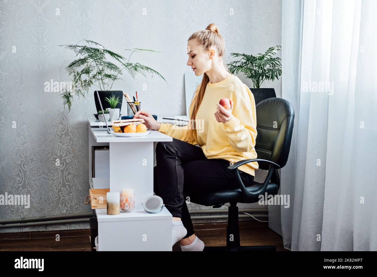Woman desk crisps hi-res stock photography and images - Alamy