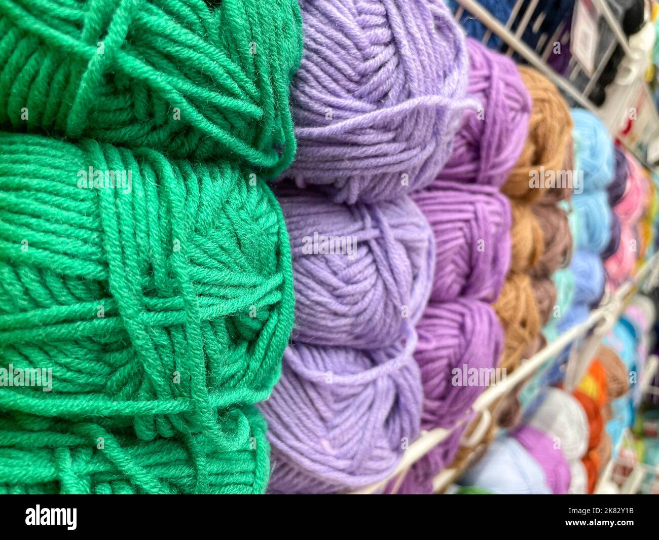 Multi colored balls of yarn for knitting. Woolen threads for needlework ...