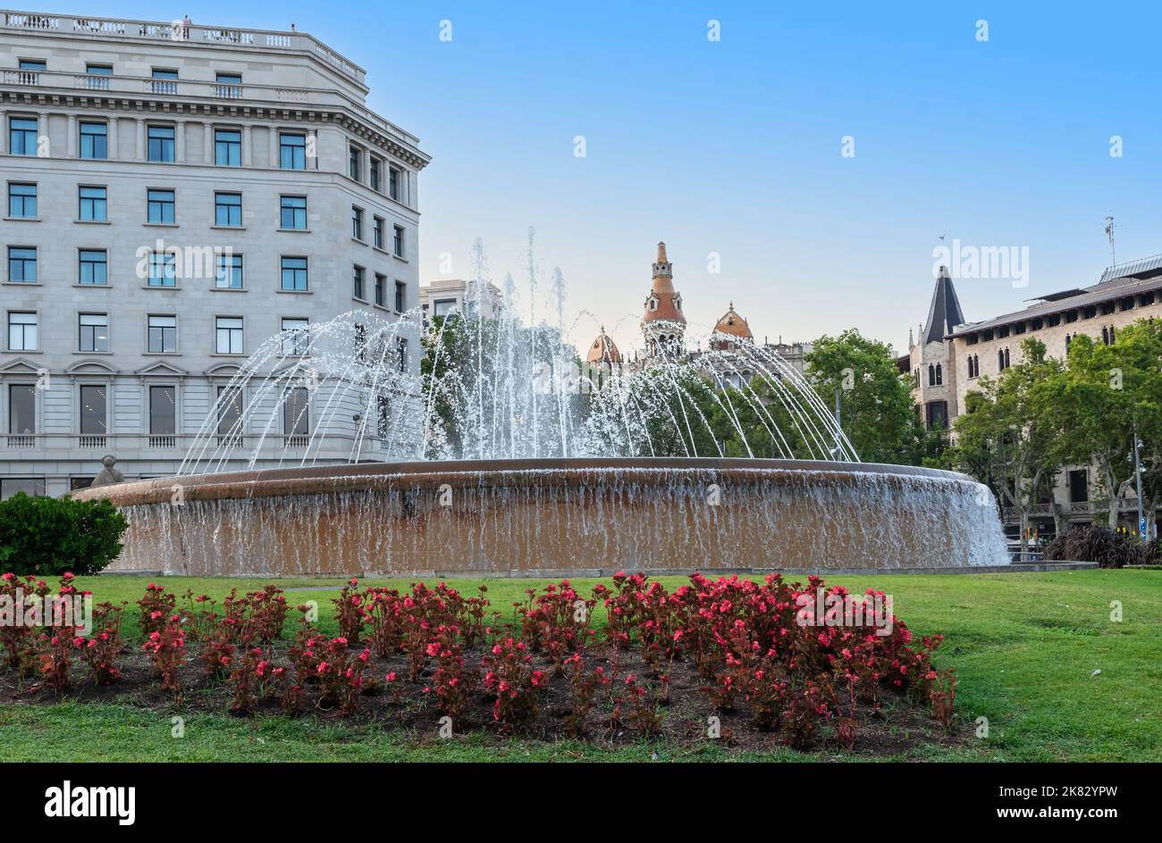 Big fountain on large Catalonia square "Placa de Catalunya" in central ...