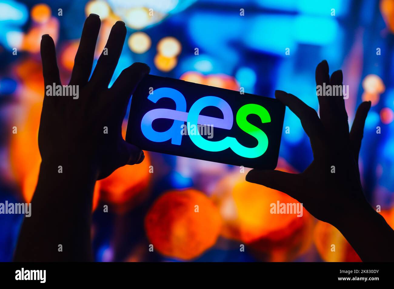 In this photo illustration, the AES Corporation logo is displayed on a ...