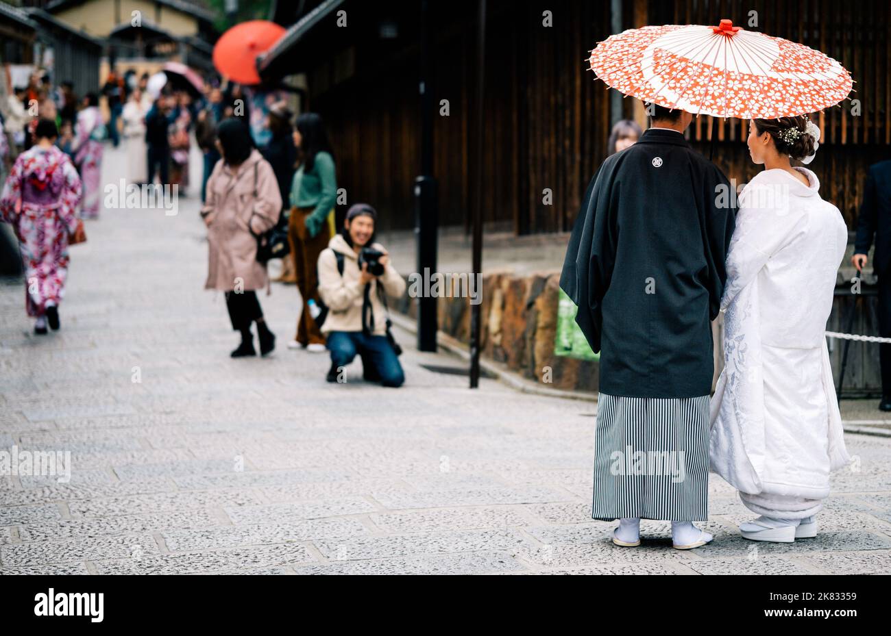 A japanese couple on their wedding day dressed up in traditional kimono ...