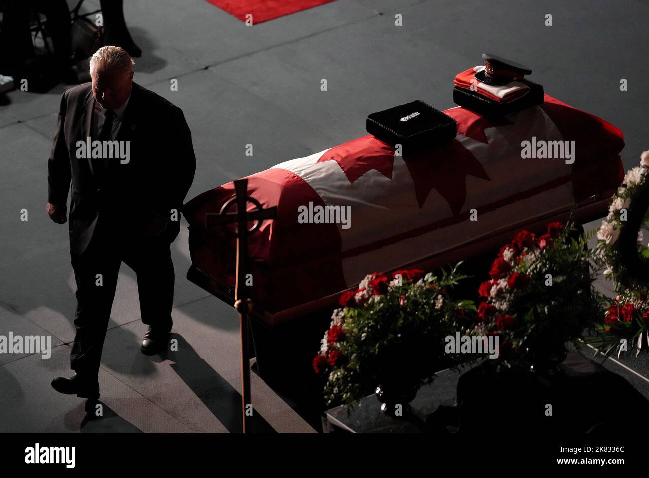 Ontario Premier Doug Ford walks past the casket of South Simcoe Police ...
