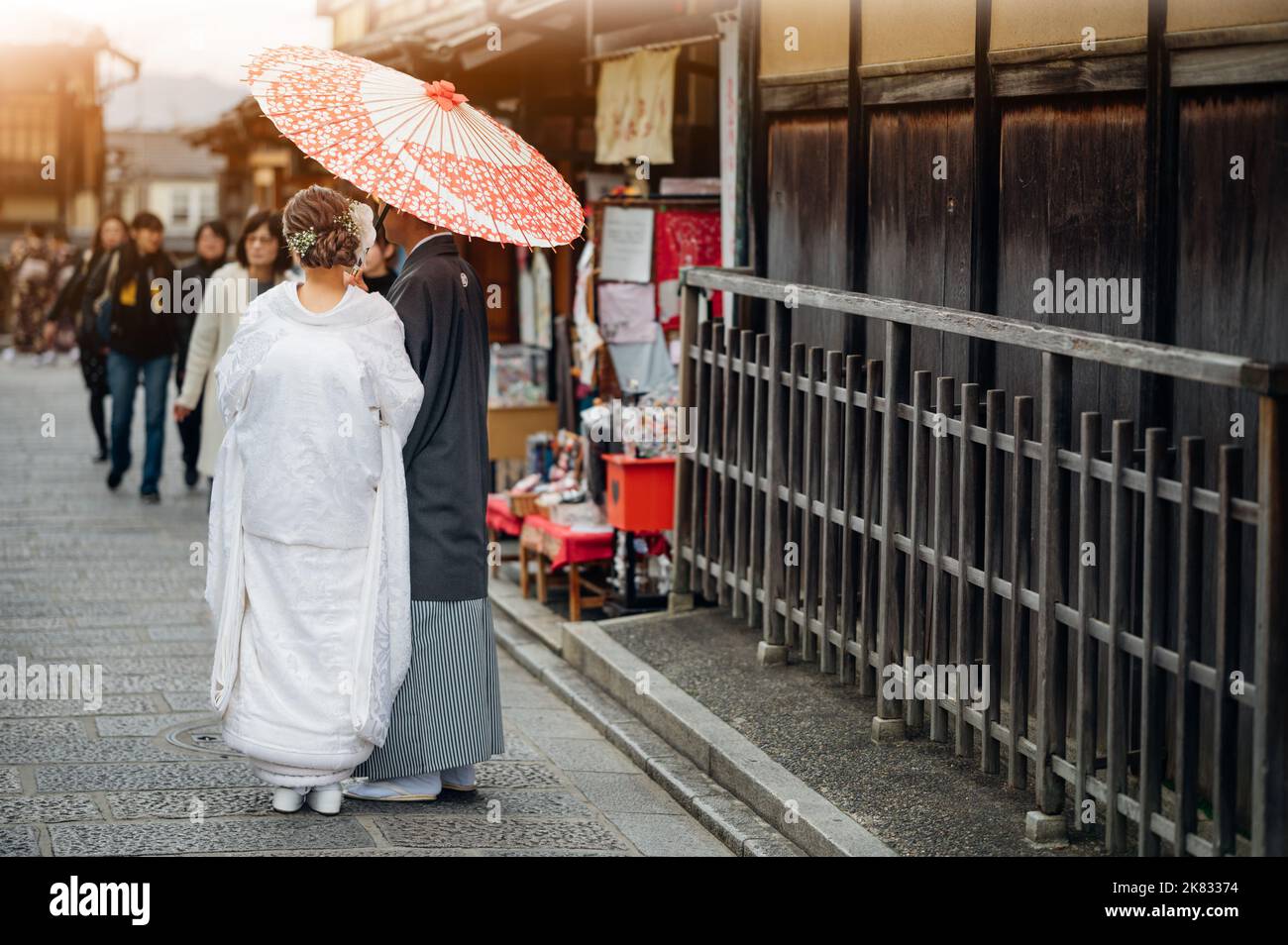 A japanese couple on their wedding day dressed up in traditional kimono ...