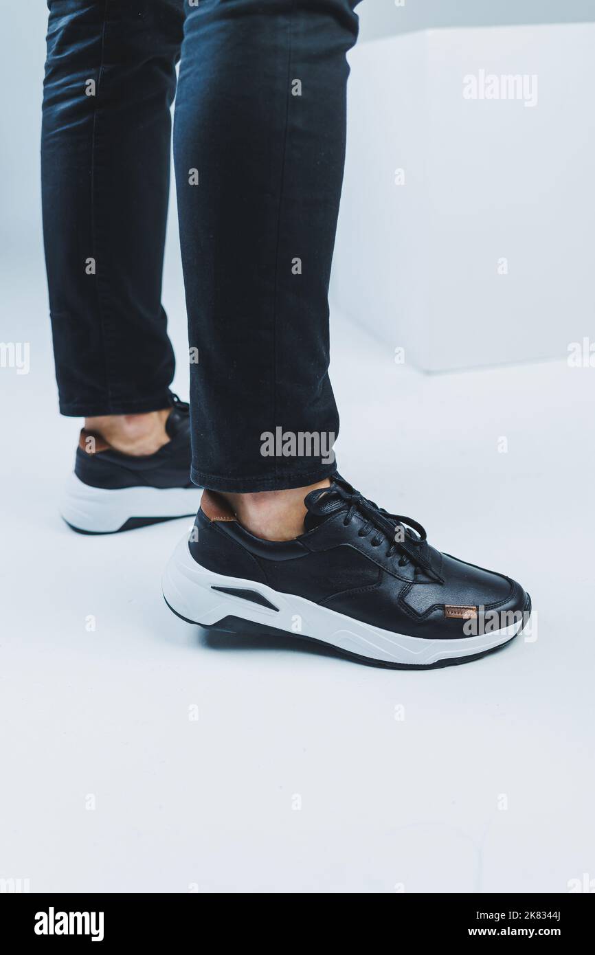Men's legs in casual shoes of black color made of genuine leather, men ...