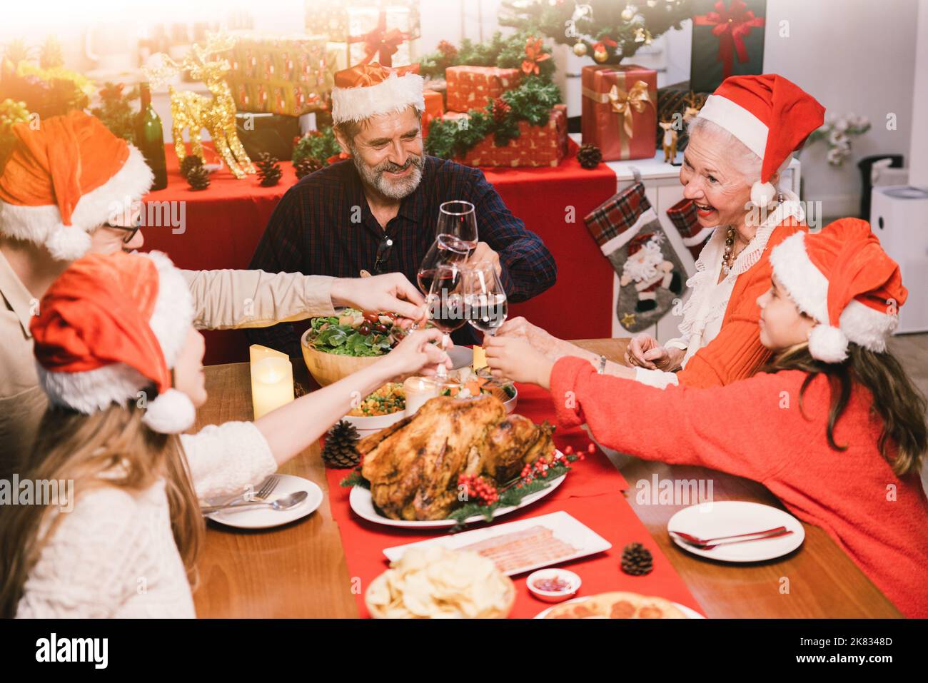 Merry Christmas! Happy family are having dinner at home. Celebration ...