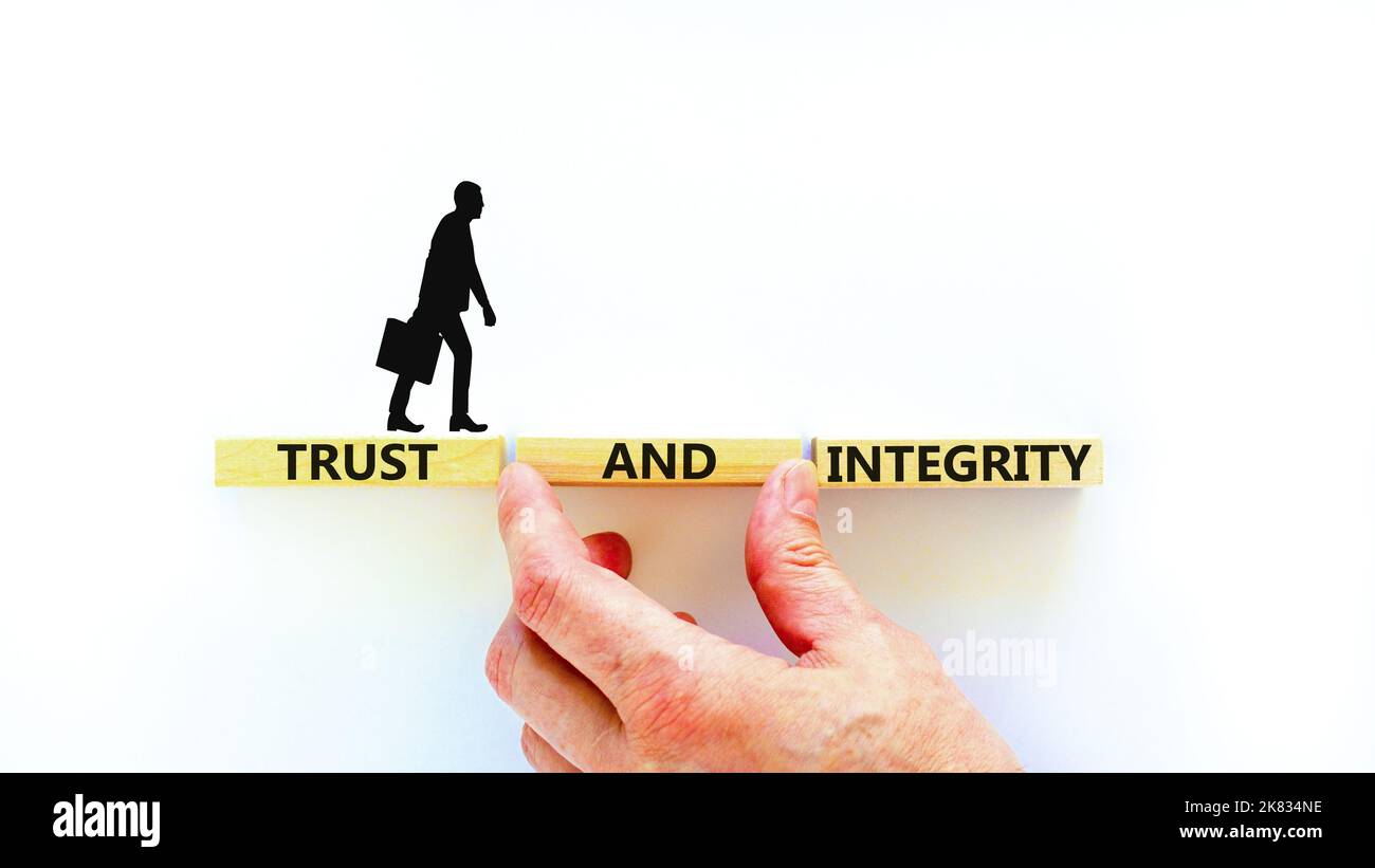 Trust and integrity symbol. Concept words Trust and integrity on wooden ...