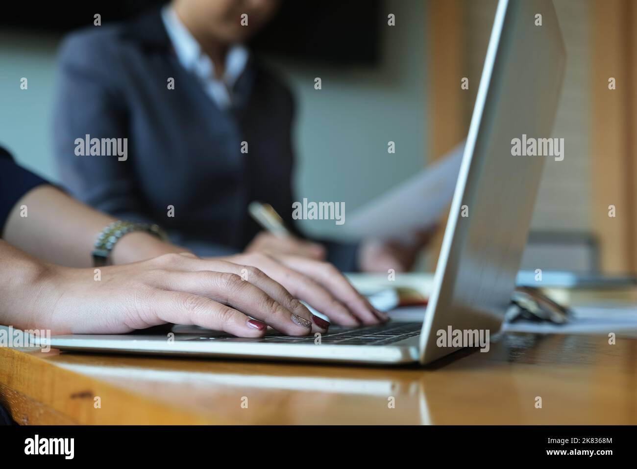 Company employees use computers to work on their work to calculate ...
