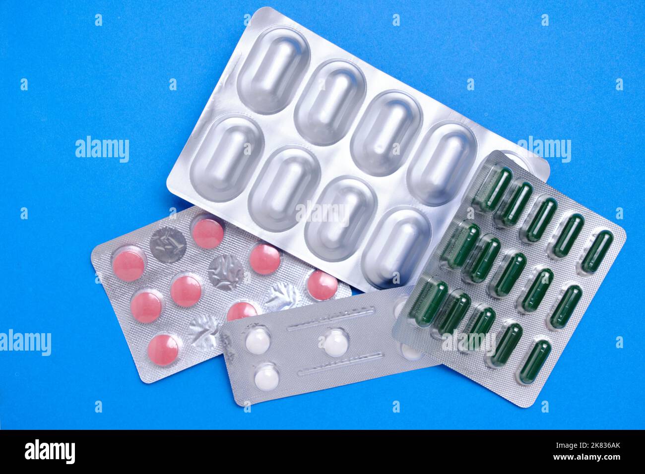 Lot of pills in package blue background. Concept shortage and rise in ...