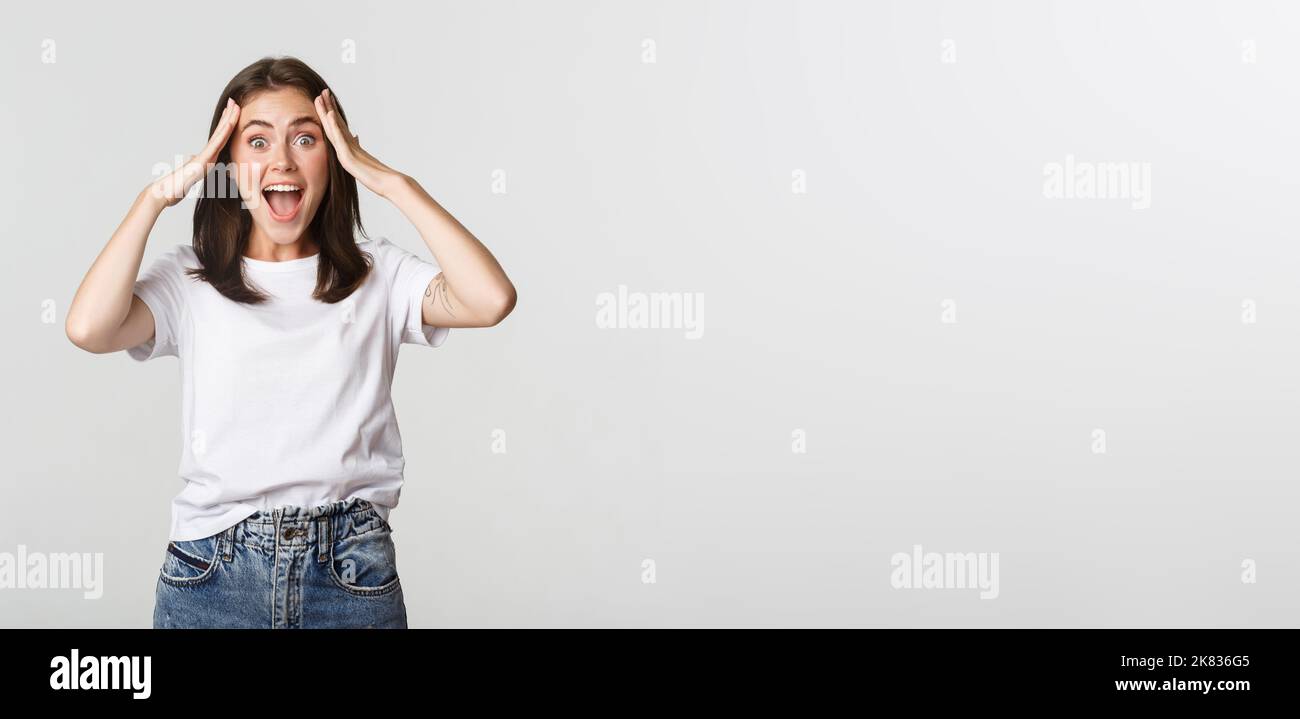 Portrait of surprised attractive girl looking excited and smiling ...