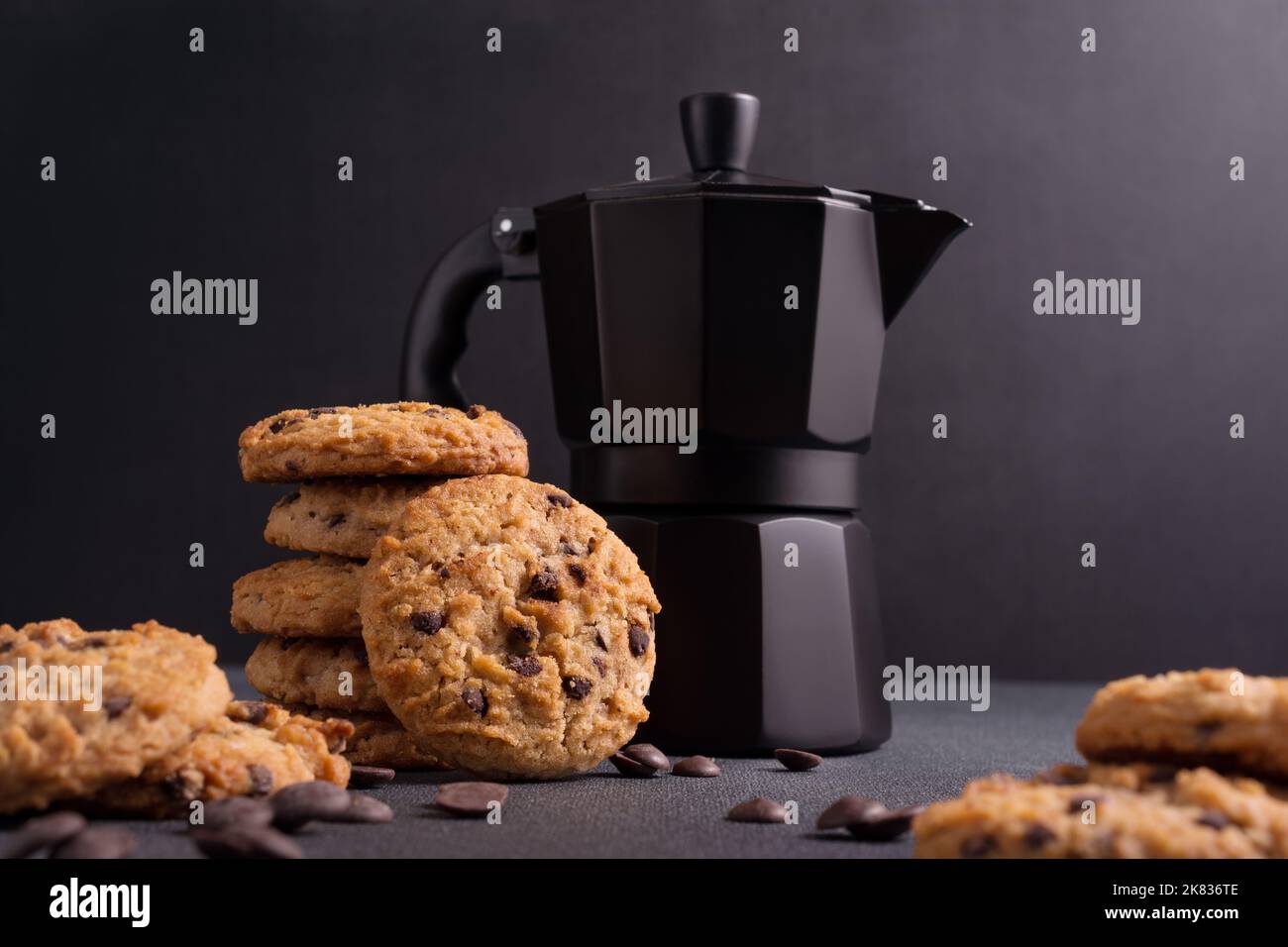 Homemade tasty chocolate chip cookies with black geyser coffee maker on ...