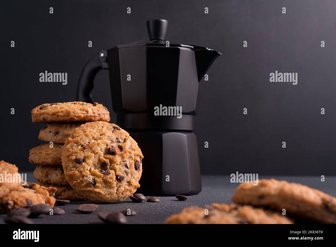 Homemade tasty chocolate chip cookies with black geyser coffee maker on ...