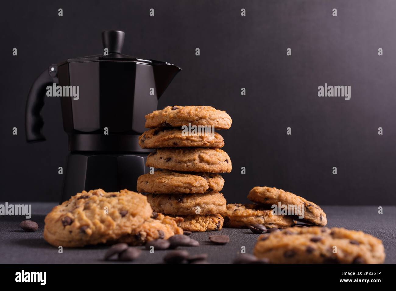 Homemade tasty chocolate chip cookies with black geyser coffee maker on ...
