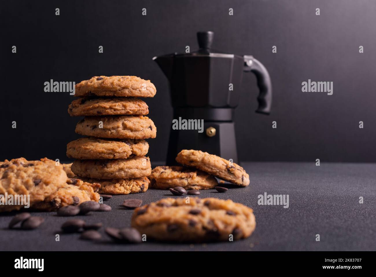 Homemade tasty chocolate chip cookies with black geyser coffee maker on ...