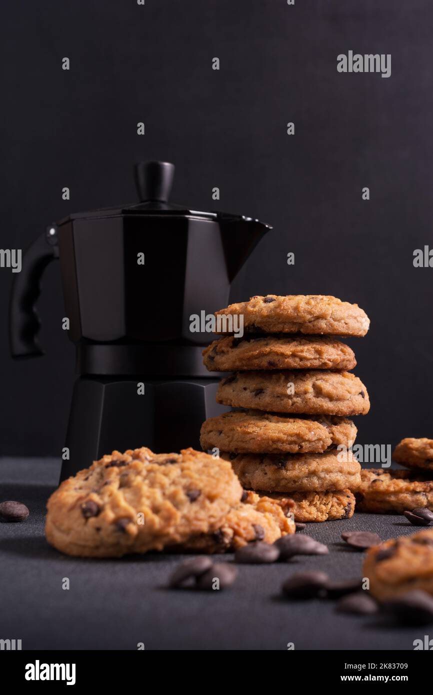 Homemade tasty chocolate chip cookies with black geyser coffee maker on ...