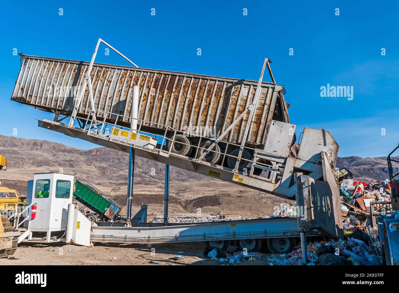 A semi-trailer tipper, and the heavy equipment used for distributing ...