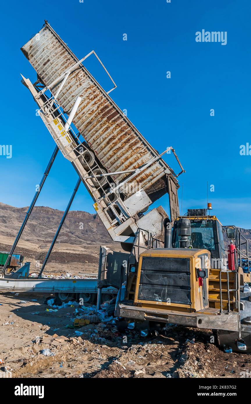 A semi-trailer tipper, and the heavy equipment used for distributing ...