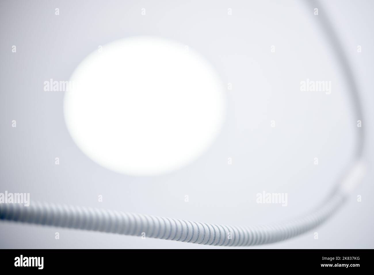 white plastic corrugated pipe on white background Stock Photo - Alamy