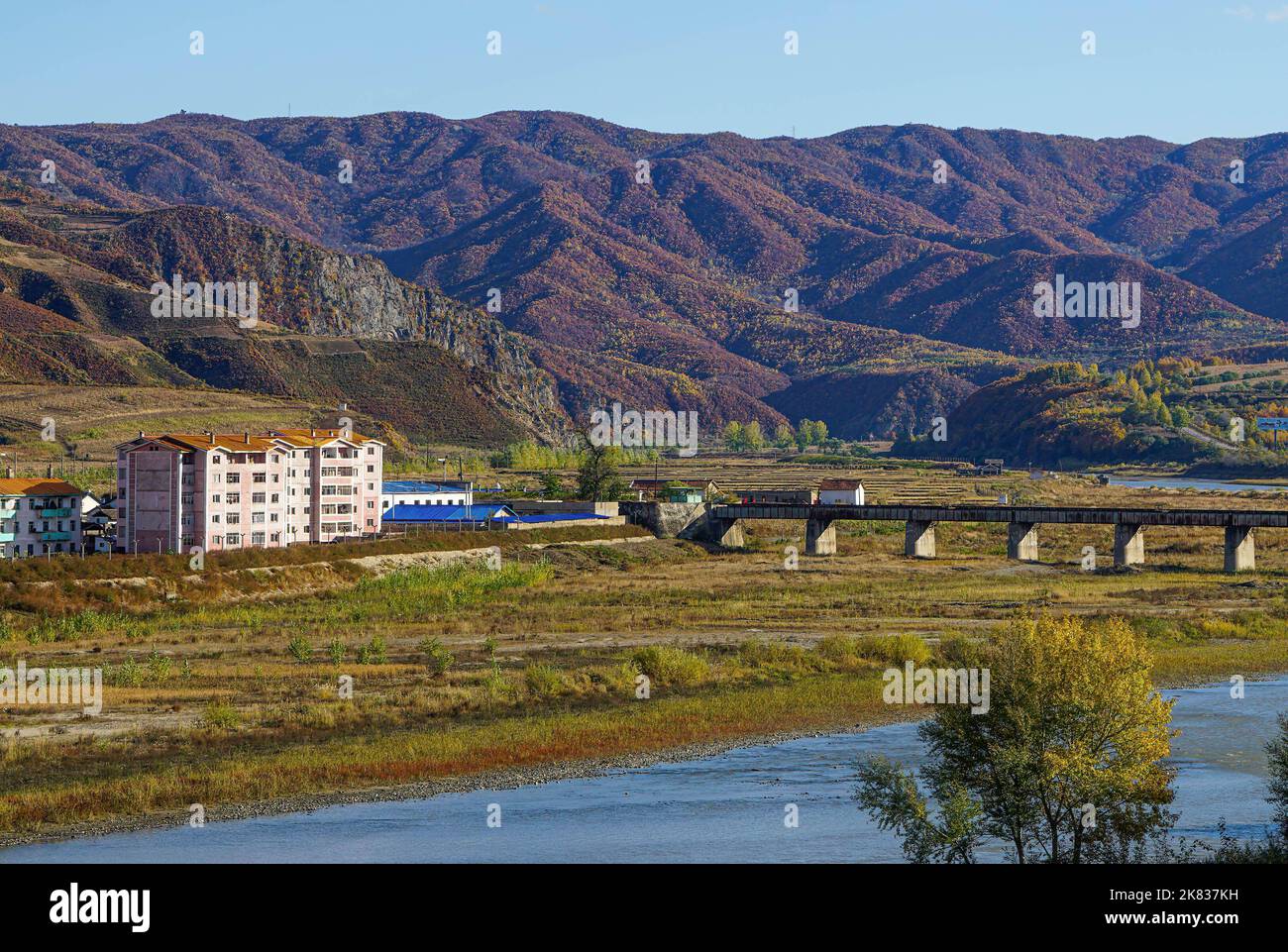 Buildings of Namyang, North Korea across the Tumen river seen from ...