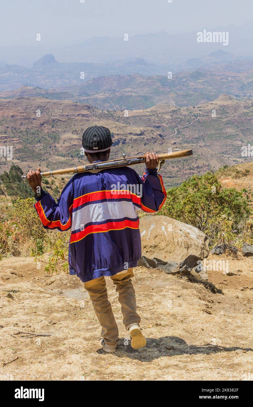 KOSOYE, ETHIOPIA - MARCH 14, 2019: Armed scout in the mountains near ...