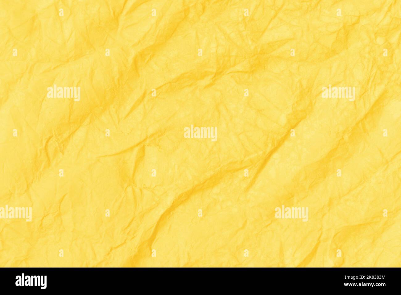 Crumpled paper abstract background texture. Yellow color. Full frame ...