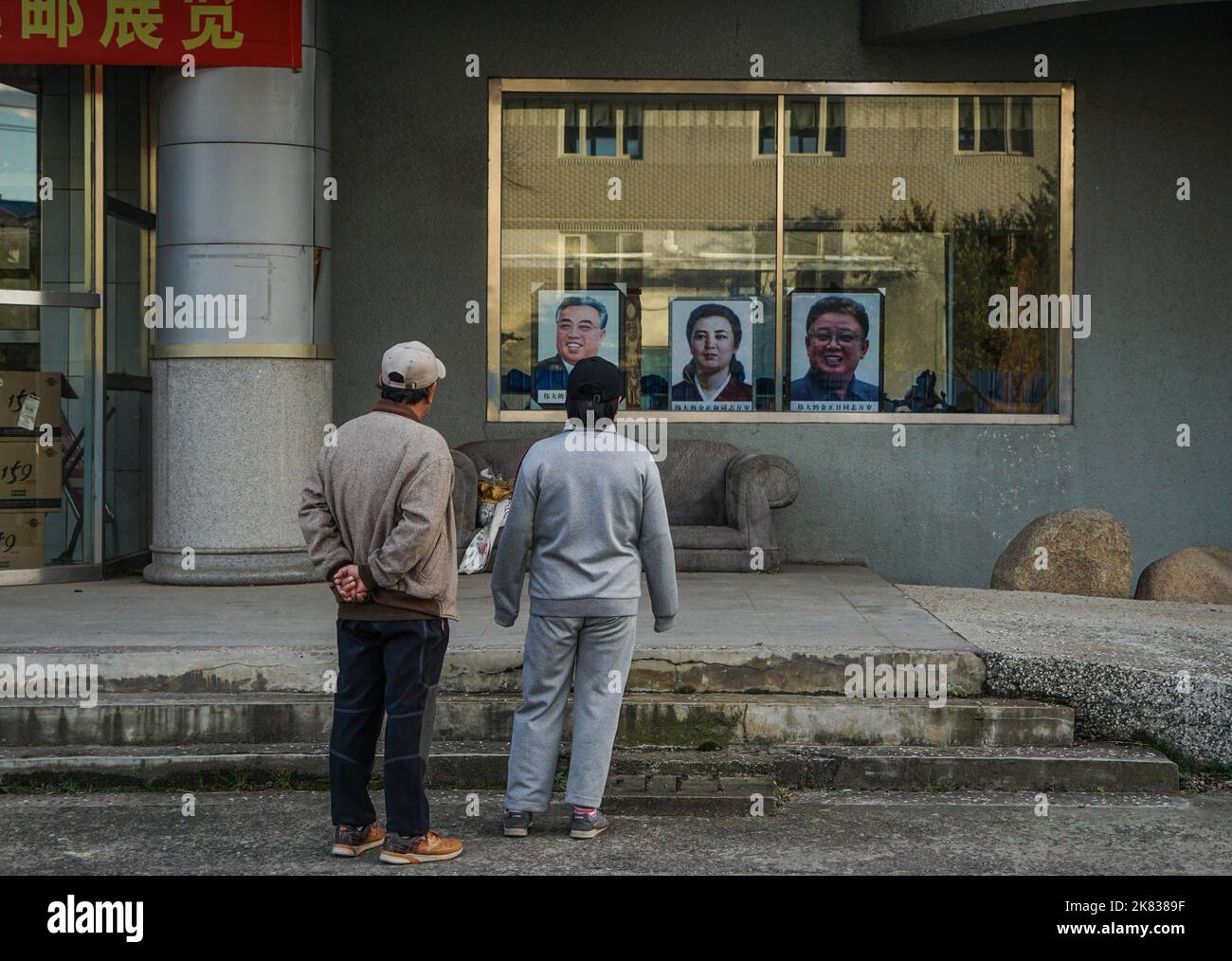 October 15, 2018, Tumen, China: A couple seen looking at the windows ...