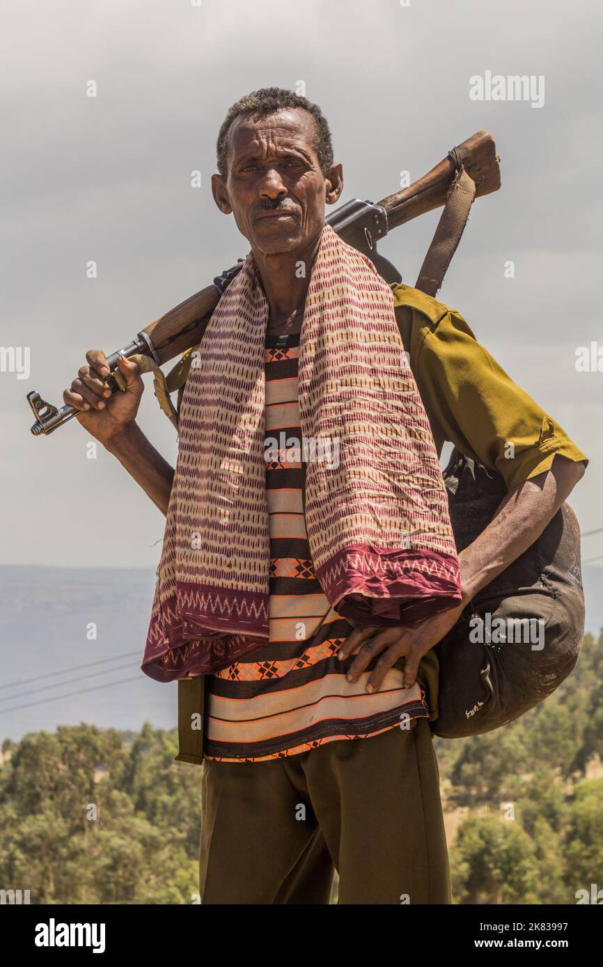 SIMIEN MOUNTAINS, ETHIOPIA - MARCH 15, 2019: Armed scout guarding ...