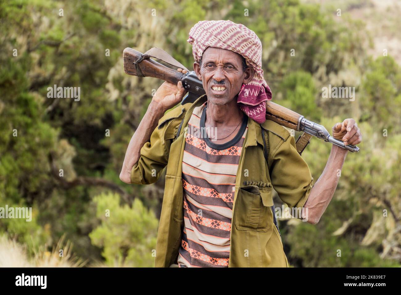 SIMIEN MOUNTAINS, ETHIOPIA - MARCH 15, 2019: Armed scout guarding ...