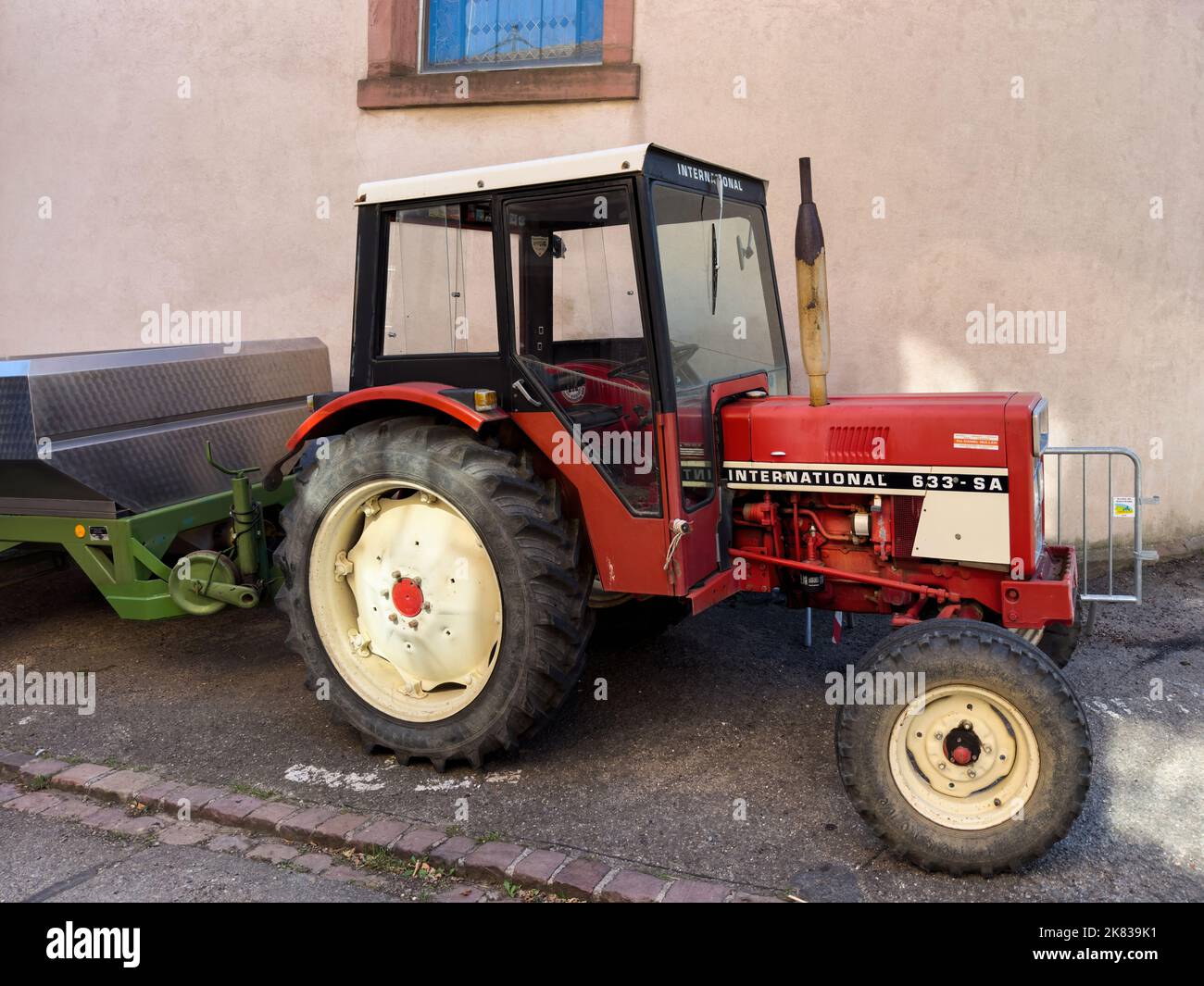 France - Sep 22, 2022: Red International 633 SA tractor with stainless ...