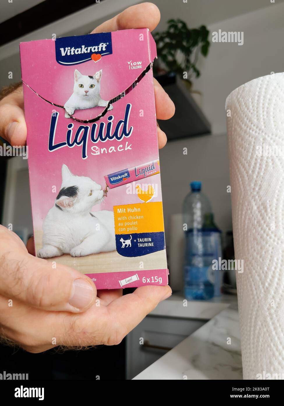 Paris, France - Sep 13, 2022: POV male hand holding pouch with ...