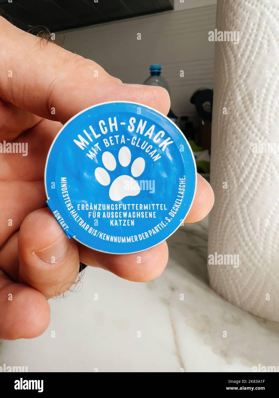 Paris, France - Sep 13, 2022: POV male hand holding Milch-Snack with ...