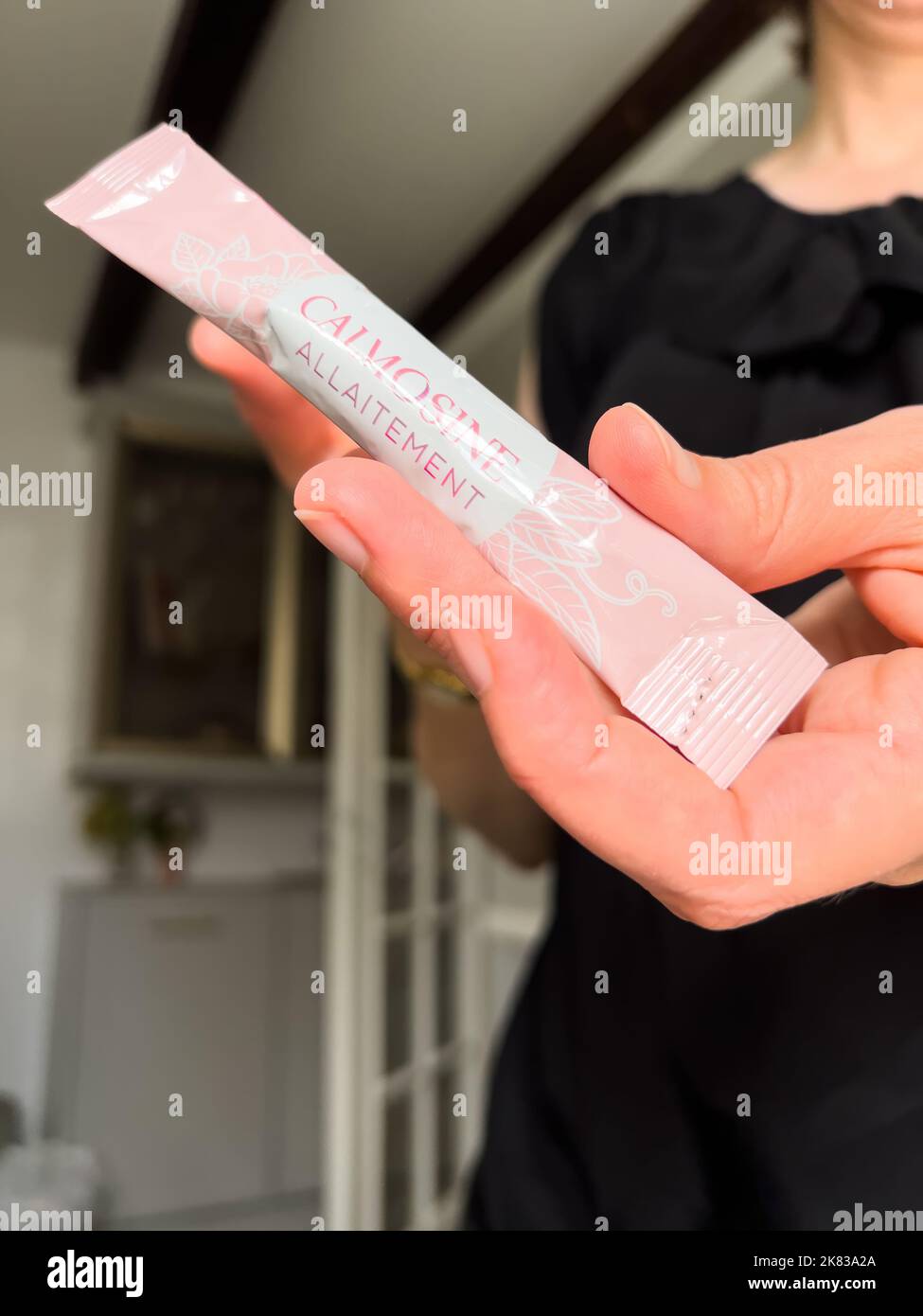 Paris, France - Sep 13, 2022: Woman hand holding calmosine pack for ...