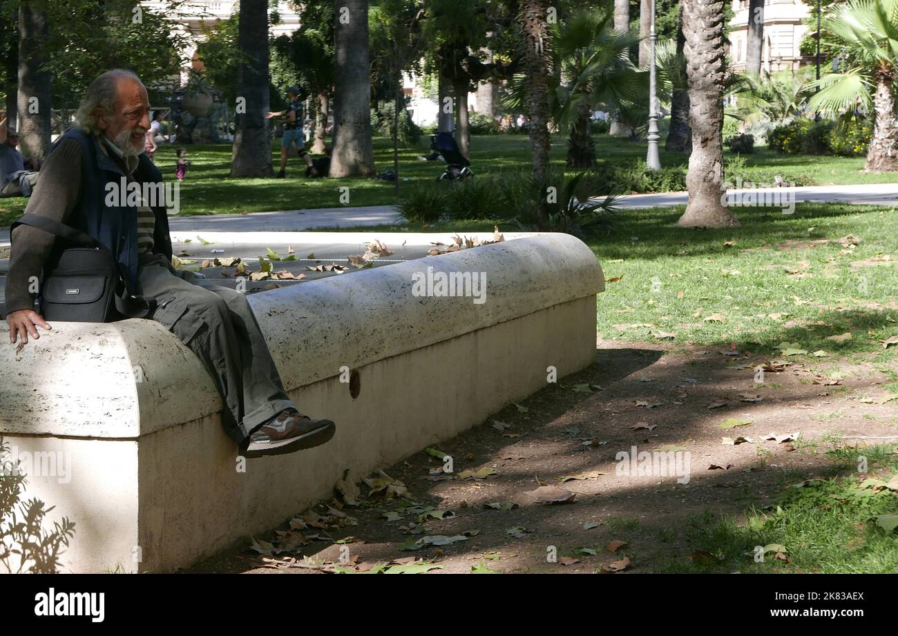 A man sits in a park in Rome, Italy, October 18 2022. The XXI Report on ...
