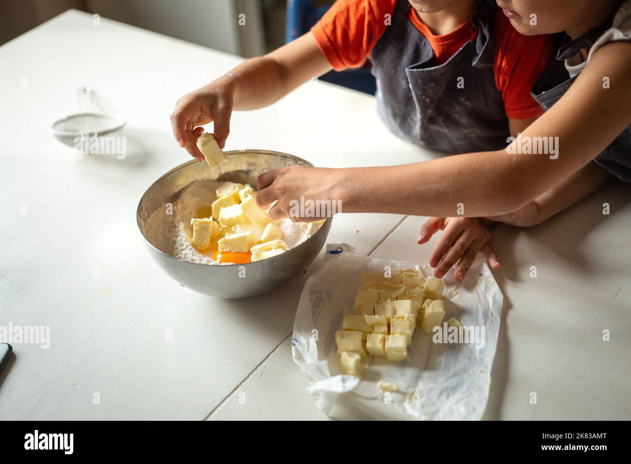 Hands adding butter in hi-res stock photography and images - Alamy
