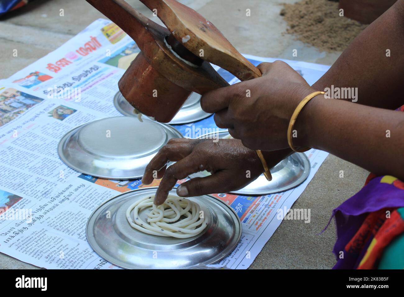Preparing South Indian Homemade rice Murukku for Diwali festival snacks ...