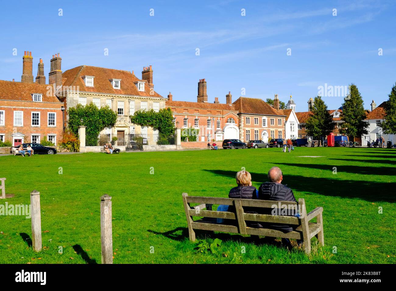 An Autumn day in Salisbury, a city in Wiltshire UK. People sitting on a ...