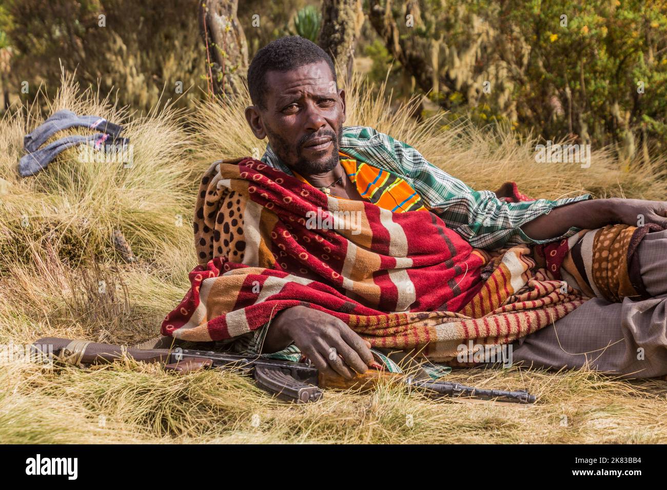 SIMIEN MOUNTAINS, ETHIOPIA - MARCH 16, 2019: Armed scout guarding ...